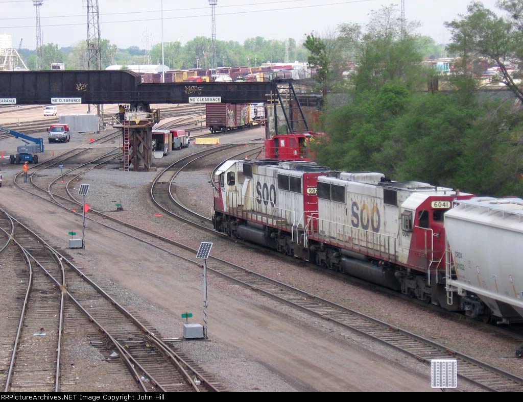 CP-BN Transfer arrives BNSF Northtown Yard on the North Receiver near CTC 35th